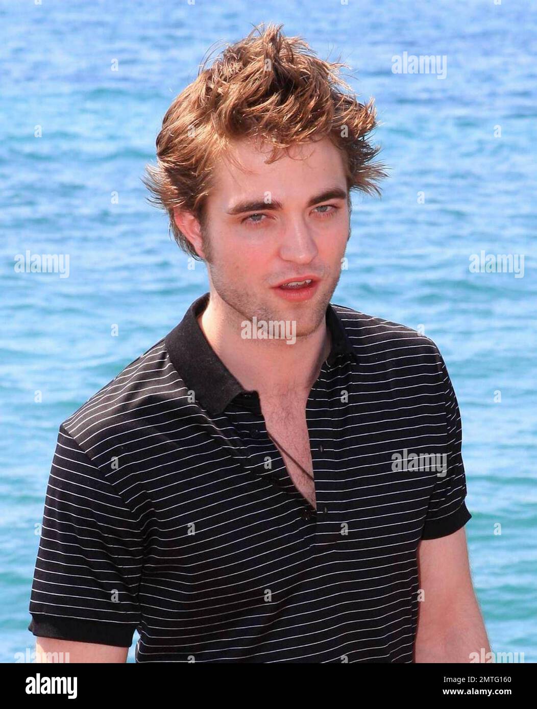 Robert Pattinson poses for the cameras at the Cannes Film Festival. The ...