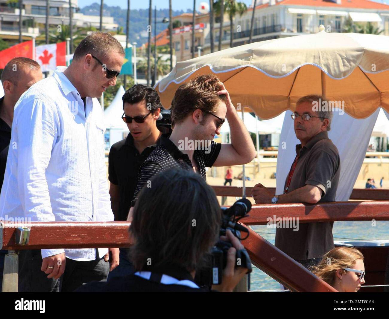 Robert Pattinson poses for the cameras at the Cannes Film Festival. The ...