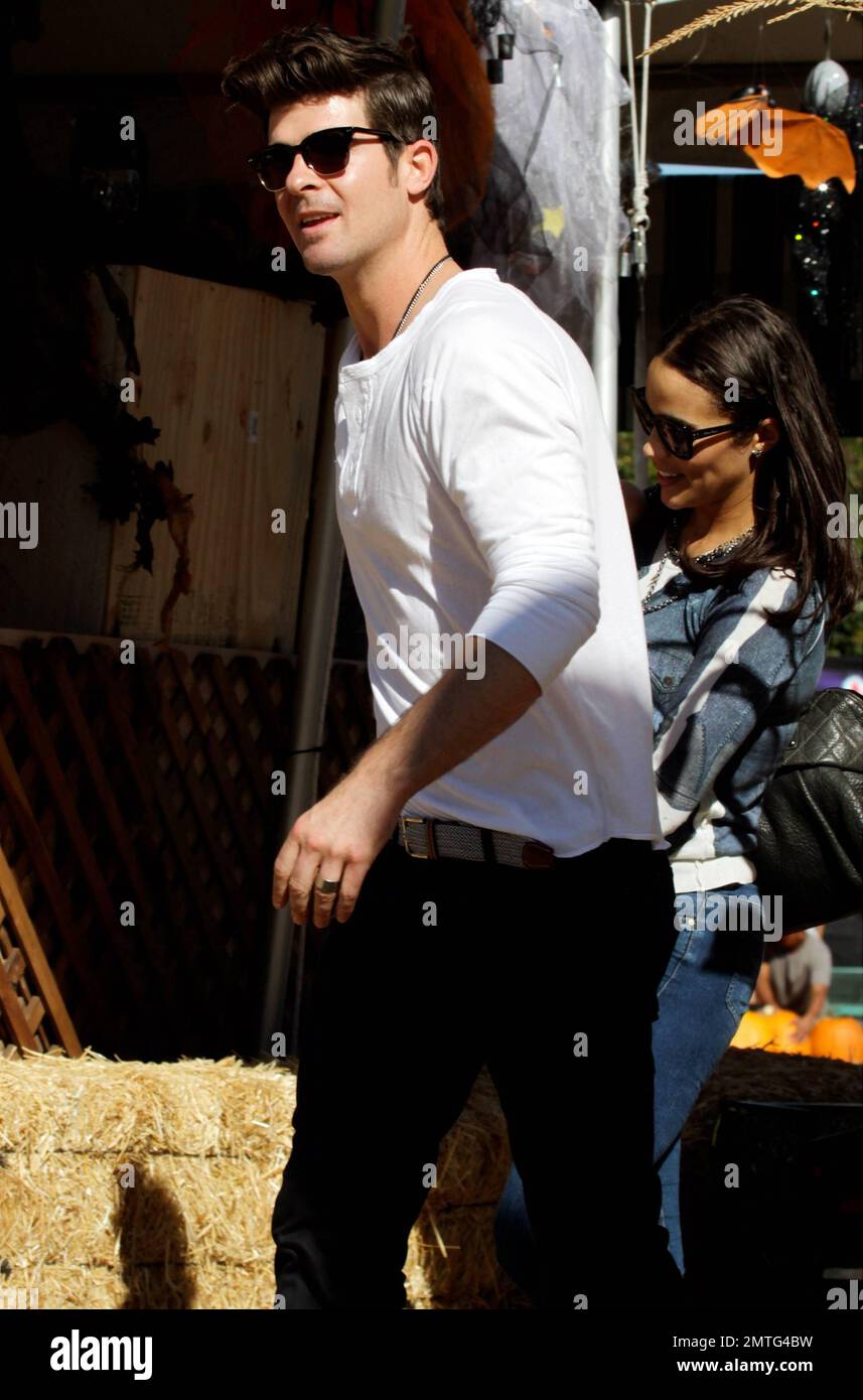 Grammy Award-winning R&B singer Robin Thicke along with his actress ...