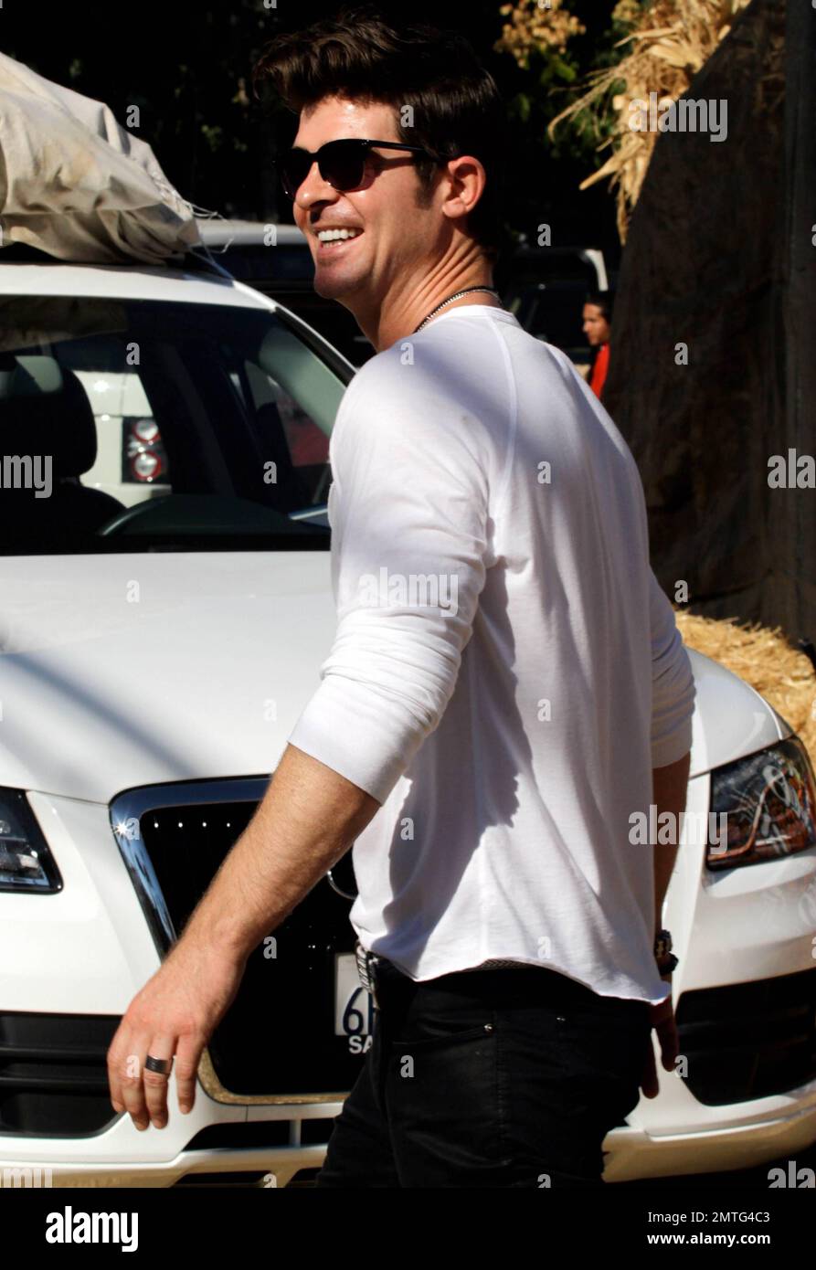 Grammy Award-winning R&B singer Robin Thicke along with his actress ...