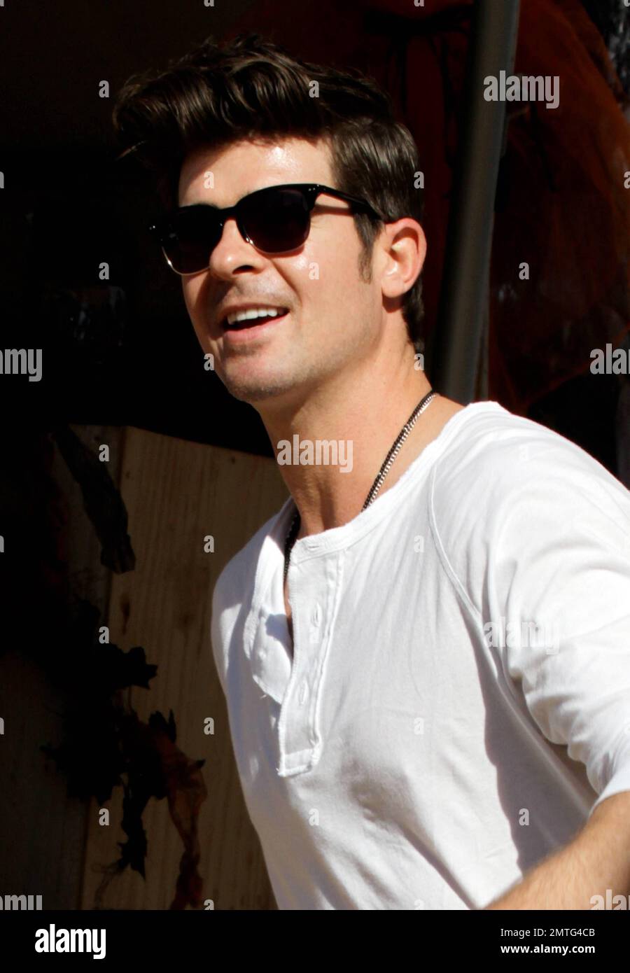 Grammy Award-winning R&B singer Robin Thicke along with his actress ...