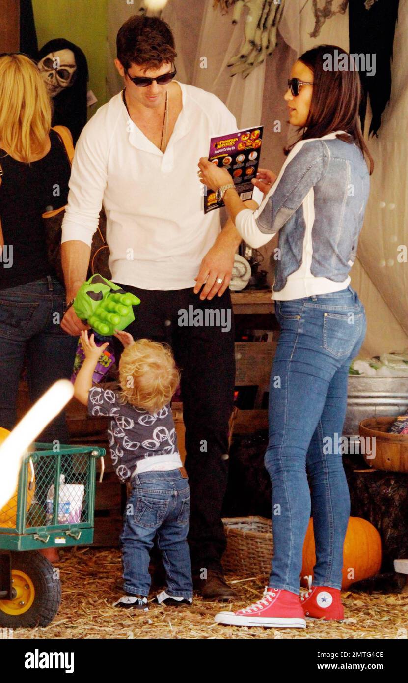 Grammy Award-winning R&B singer Robin Thicke along with his actress ...