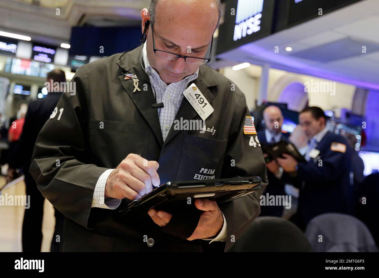 Trader Andrew Silverman works on the floor of the New York Stock ...