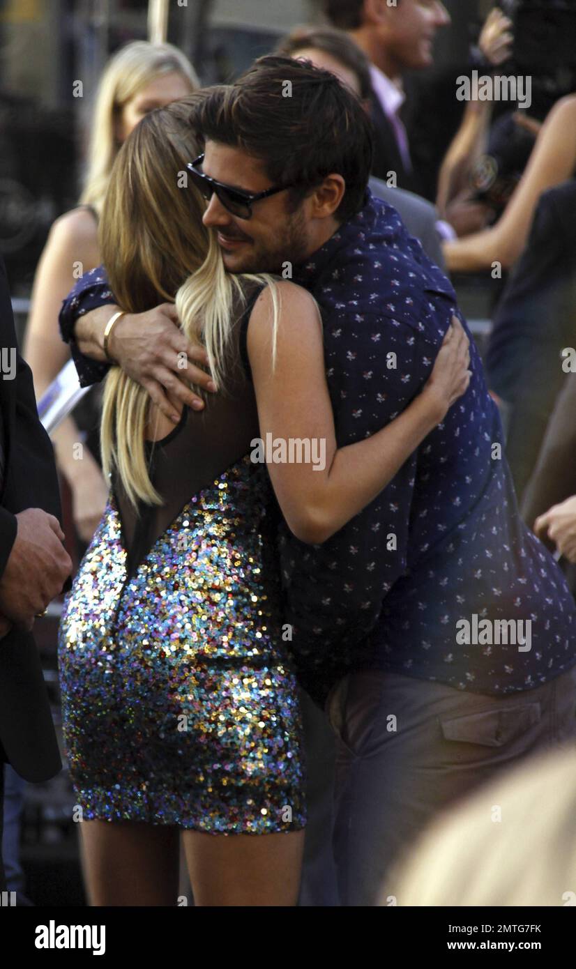Zac Efron and Ashley Tisdale hug as they arrive at the premiere of ...