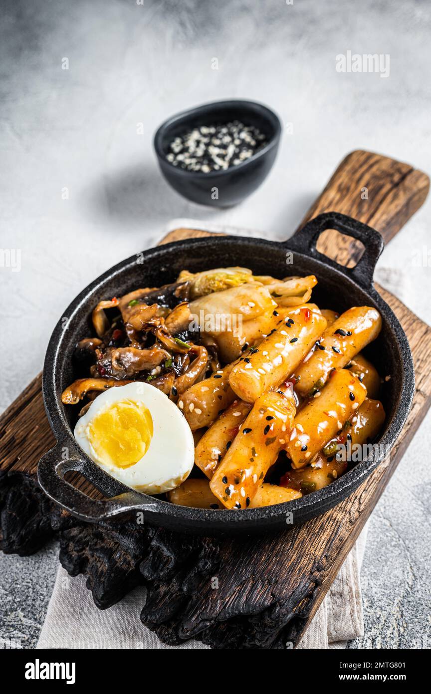 Tteokbokki, Topokki stick rice cake in spicy sauce with egg and ...