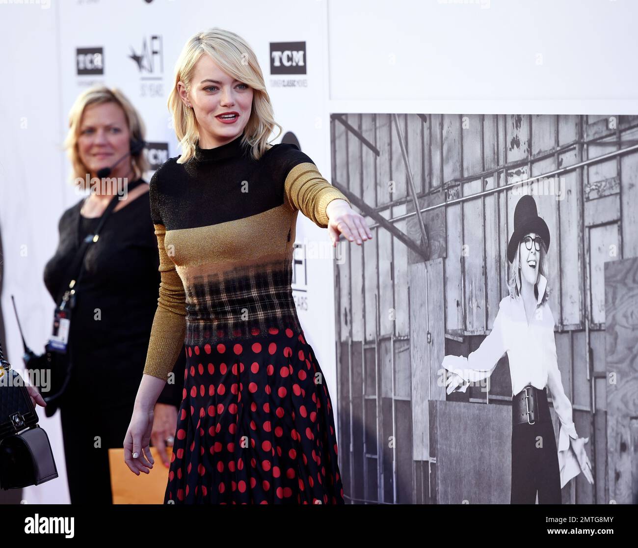 Actress Emma Stone poses at the 45th AFI Life Achievement Award Tribute ...