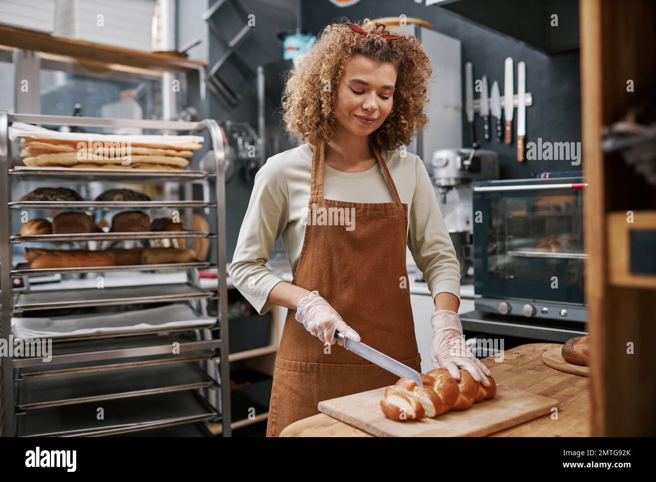 Cutting loaf baker wearing hi-res stock photography and images - Alamy