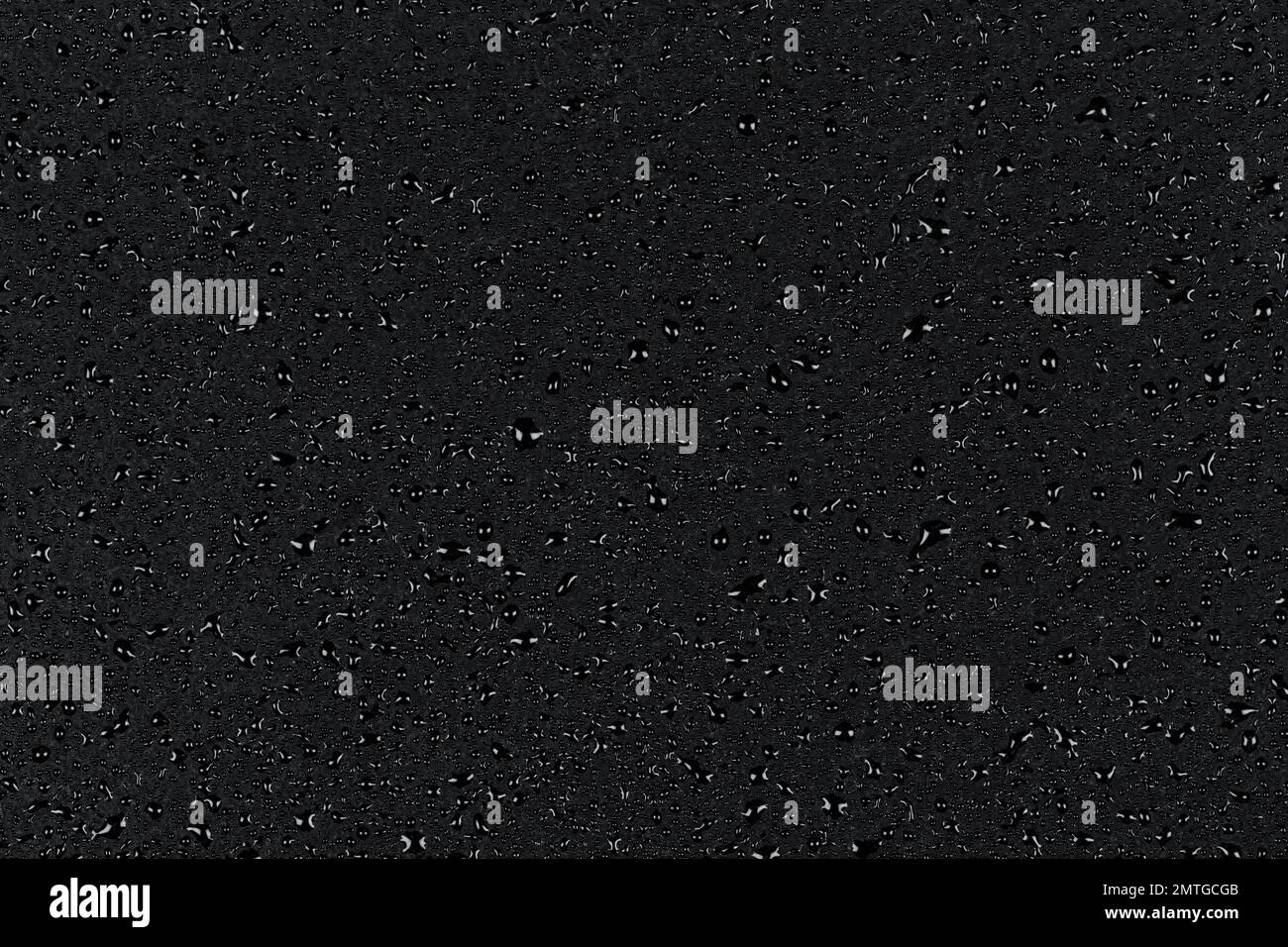 Water drops on dark stone surface texture background Stock Photo - Alamy