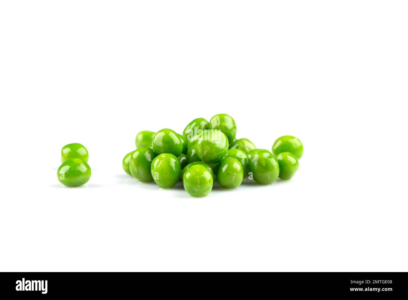 Pile of green wet pea isolated on white background Stock Photo - Alamy