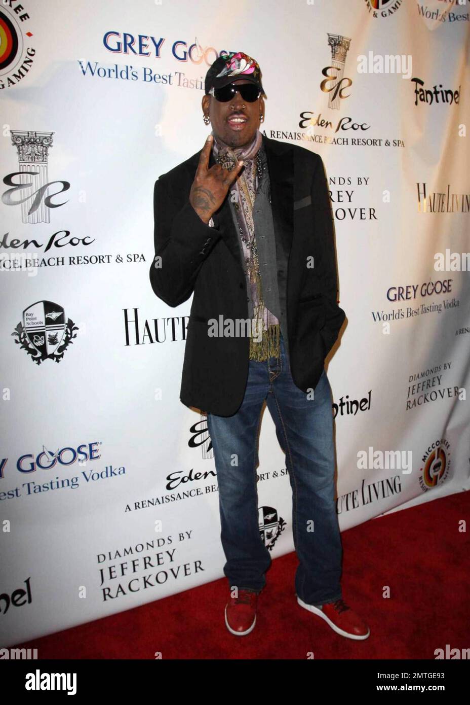 Dennis Rodman and Elaine Lancaster pose on the red carpet at the 14th ...