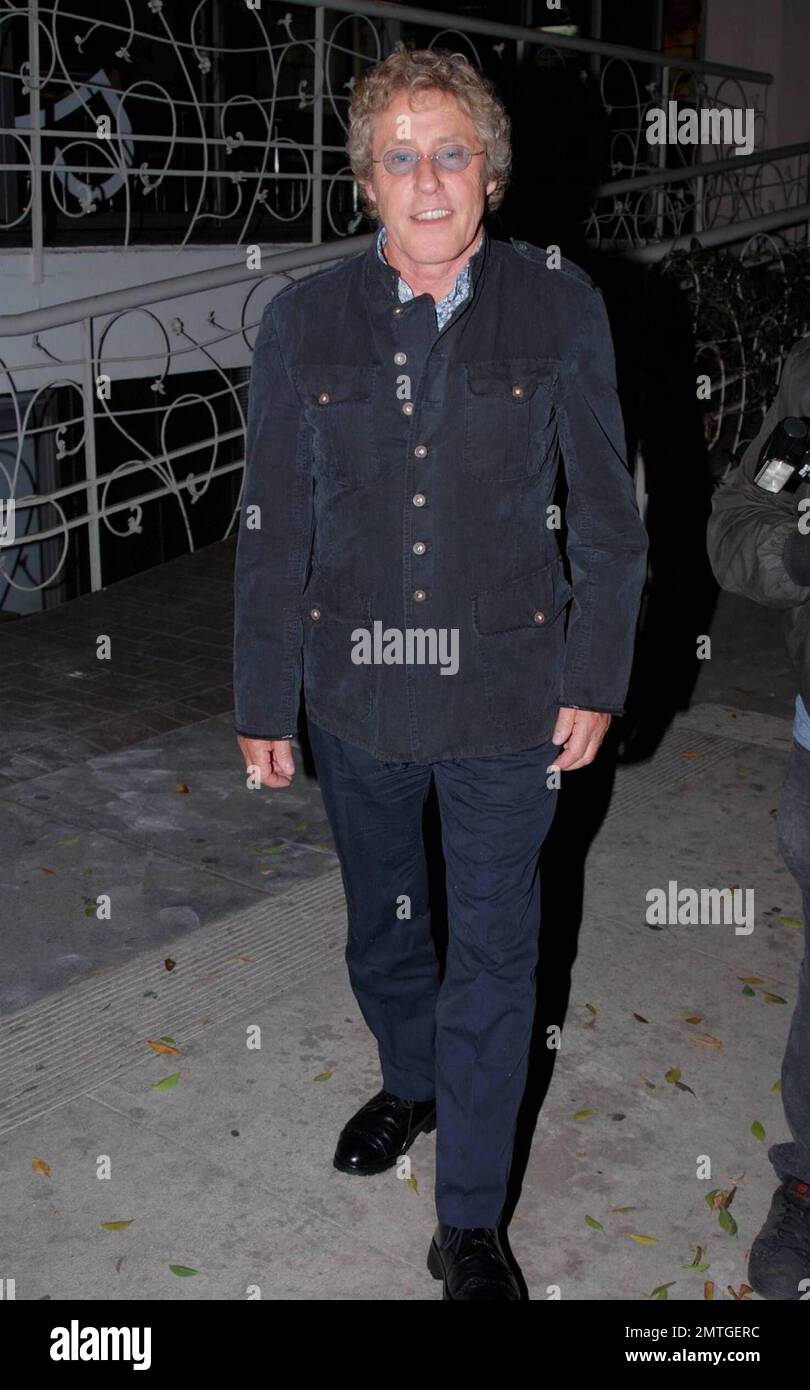 The Who frontman Roger Daltrey poses for photos with fans as he leaves ...