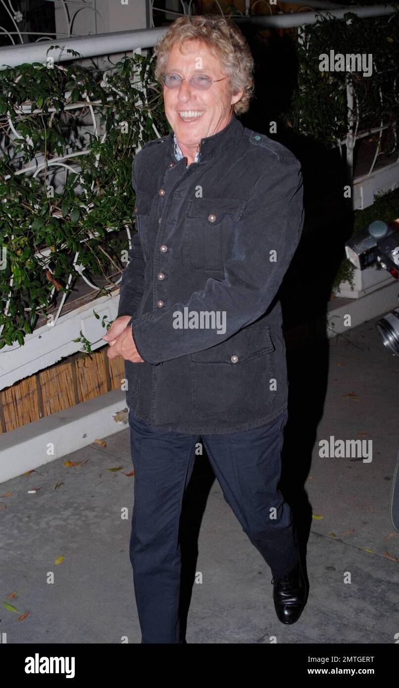 The Who frontman Roger Daltrey poses for photos with fans as he leaves ...