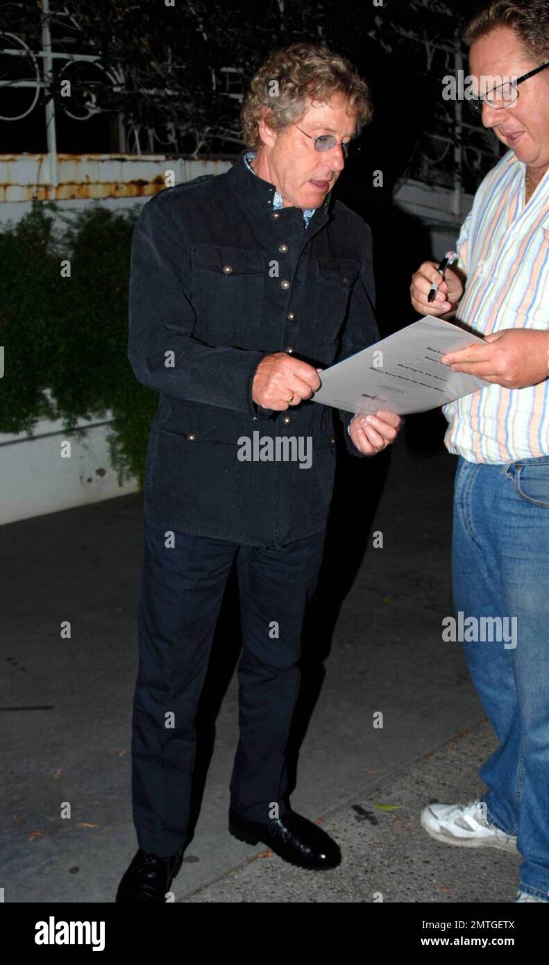 The Who frontman Roger Daltrey poses for photos with fans as he leaves ...