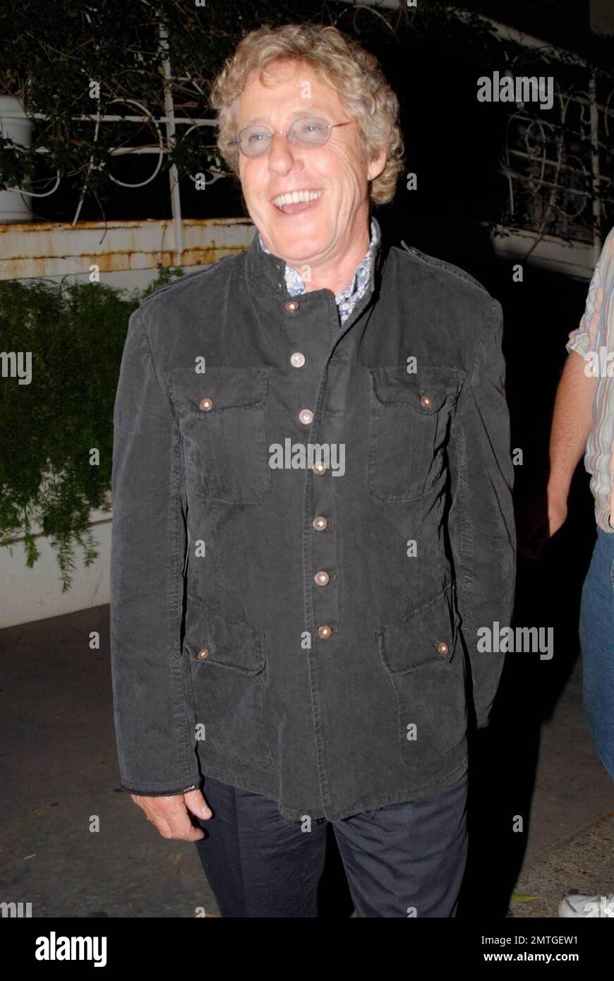 The Who frontman Roger Daltrey poses for photos with fans as he leaves ...