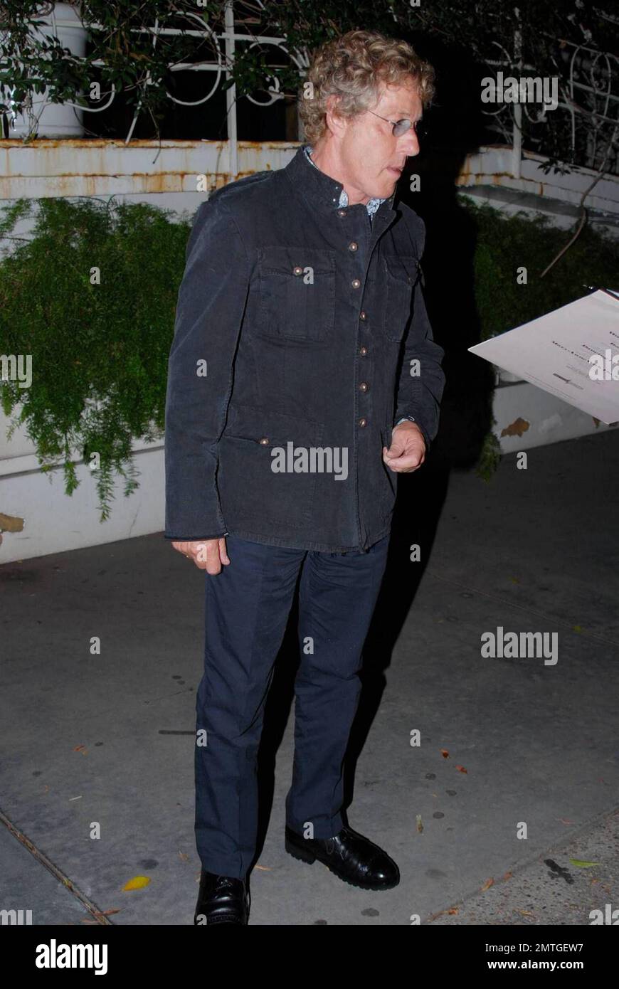 The Who frontman Roger Daltrey poses for photos with fans as he leaves ...