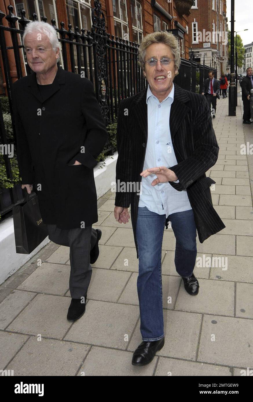 The Who singer Roger Daltrey looks quite animated as he strolls briskly ...