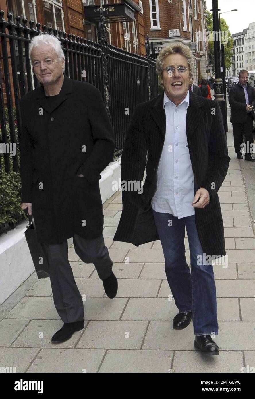 The Who singer Roger Daltrey looks quite animated as he strolls briskly ...