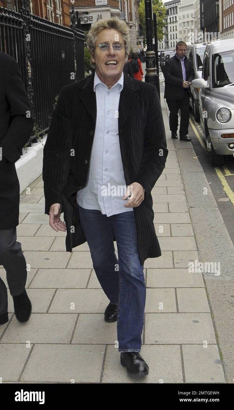The Who singer Roger Daltrey looks quite animated as he strolls briskly ...
