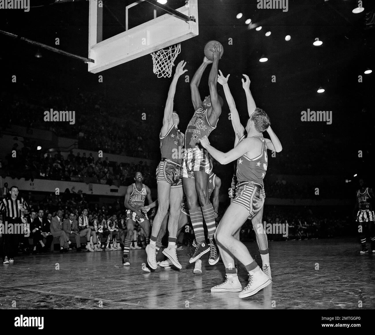 J.C. Gipson of the Harlem Globetrotters goes up to sink a basket during ...