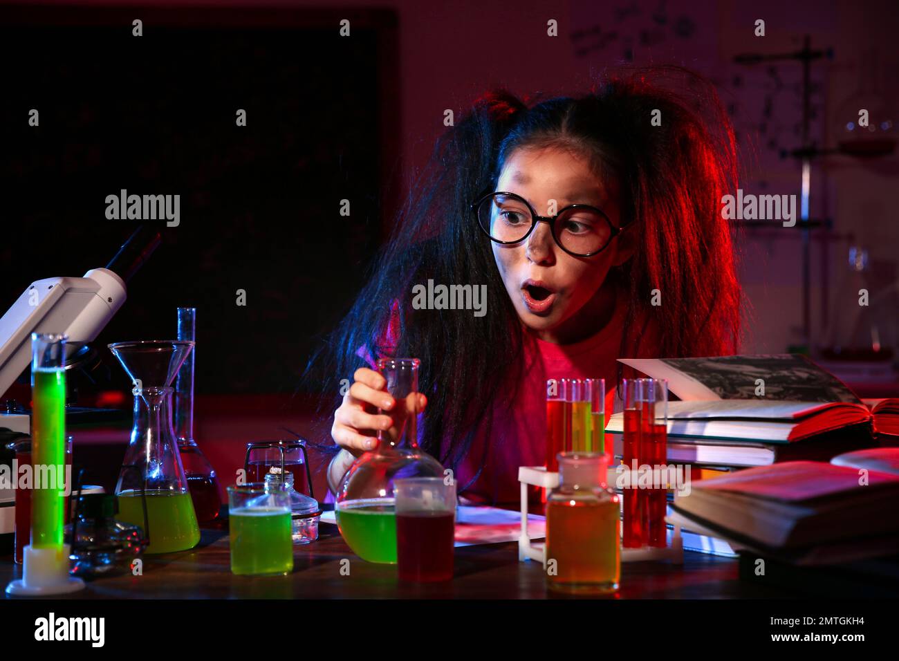 Child doing chemical research in laboratory. Dangerous experiment Stock ...