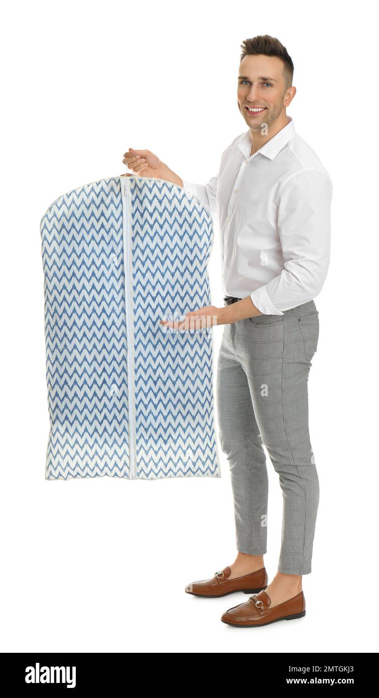 Man holding garment cover with clothes on white background. Dry ...