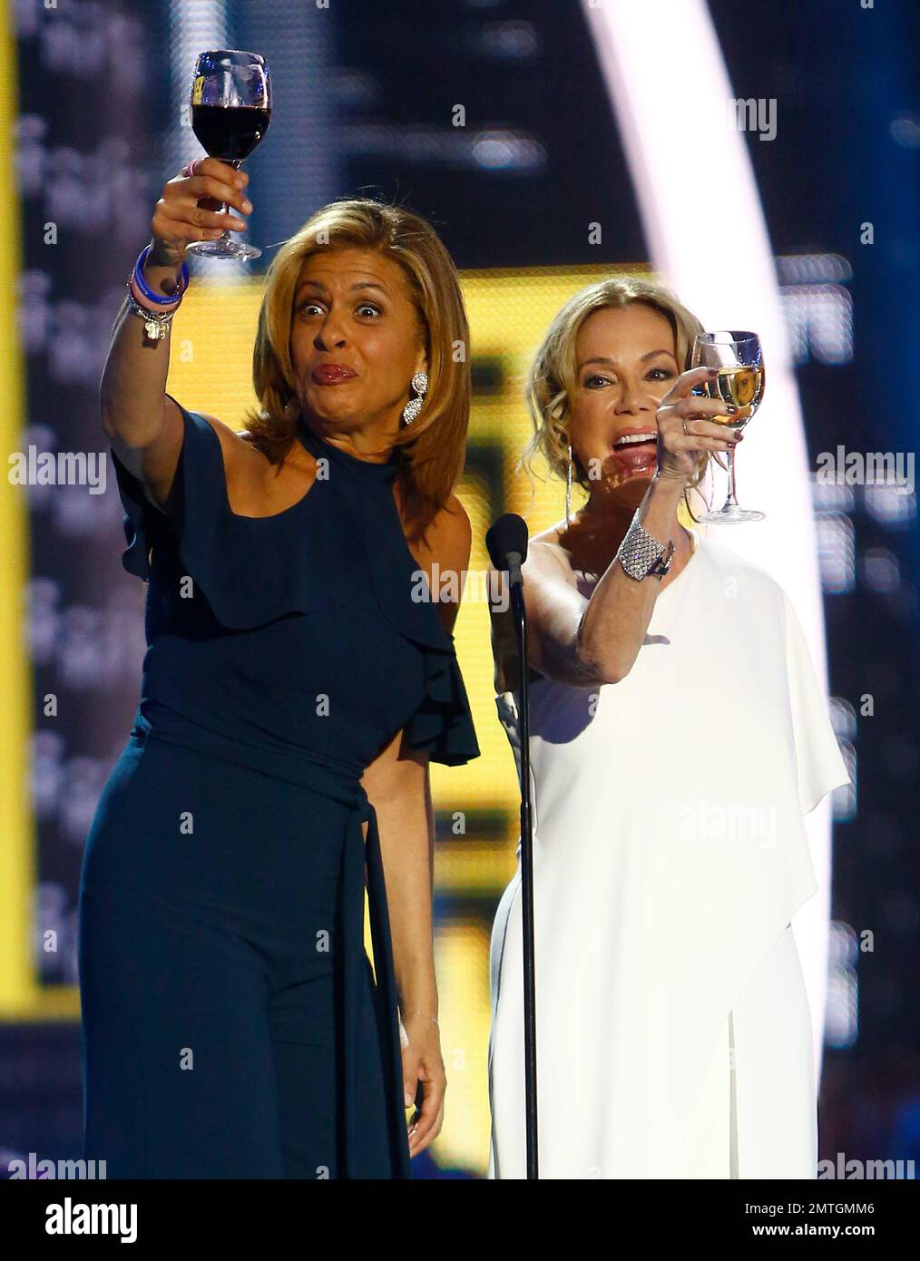 Hoda Kotb, left, and Kathie Lee Gifford give a toast as they present ...