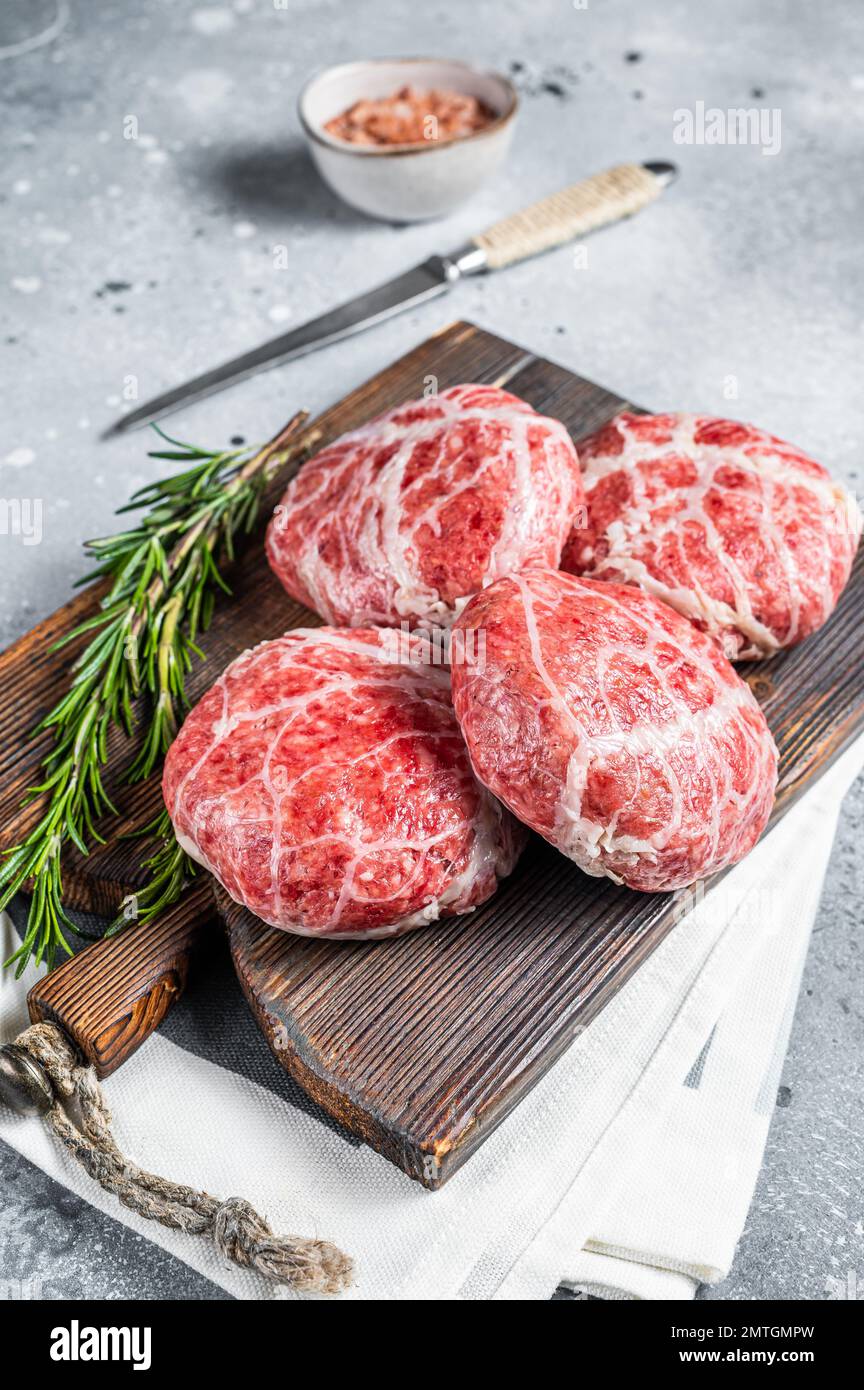 Raw Caul Fat Meatballs burger cutlets, fresh meat. Gray background. Top ...