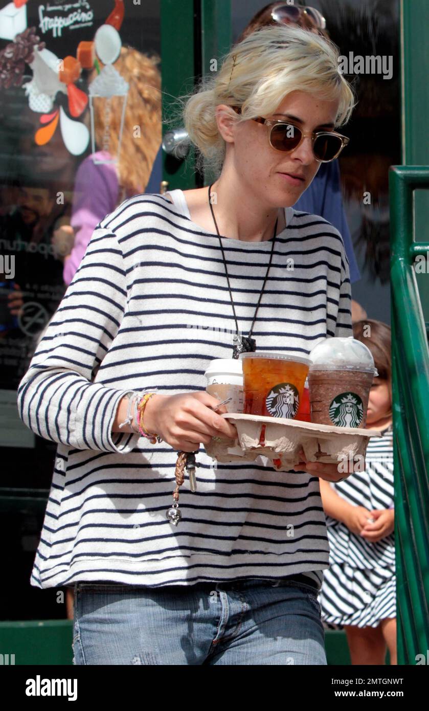 DJ Samantha Ronson and a female companion make an iced tea and coffee ...