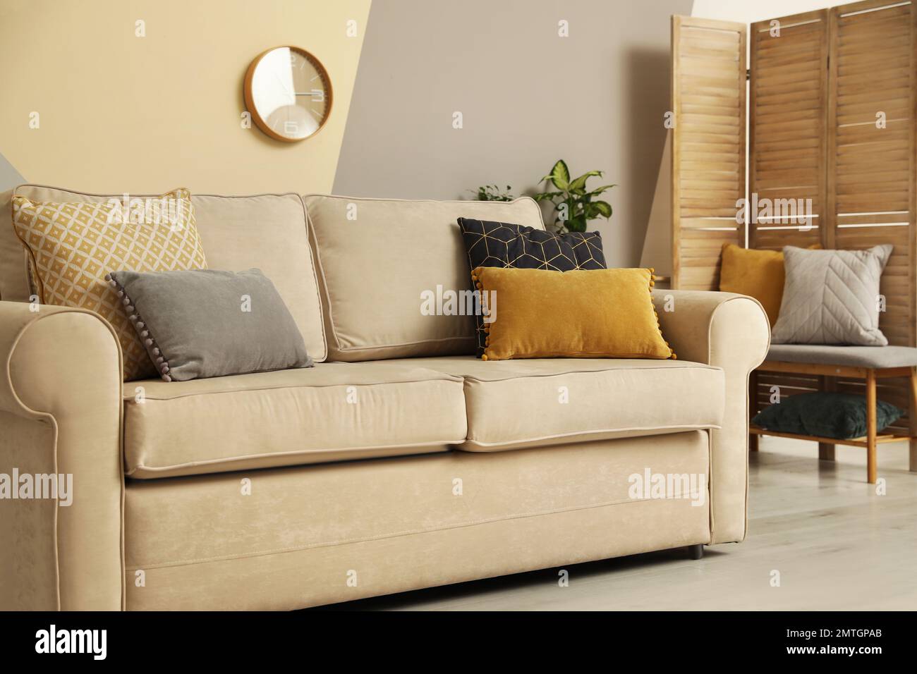 Modern comfortable sofa with pillows indoors. Stylish room interior ...