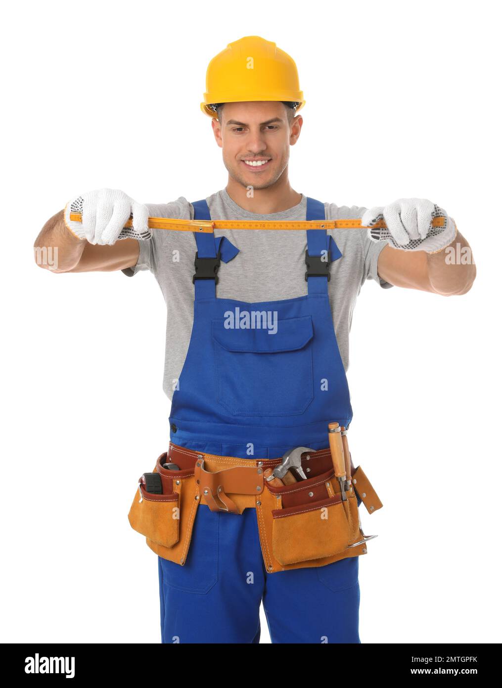 Handsome carpenter with folding rule isolated on white Stock Photo - Alamy