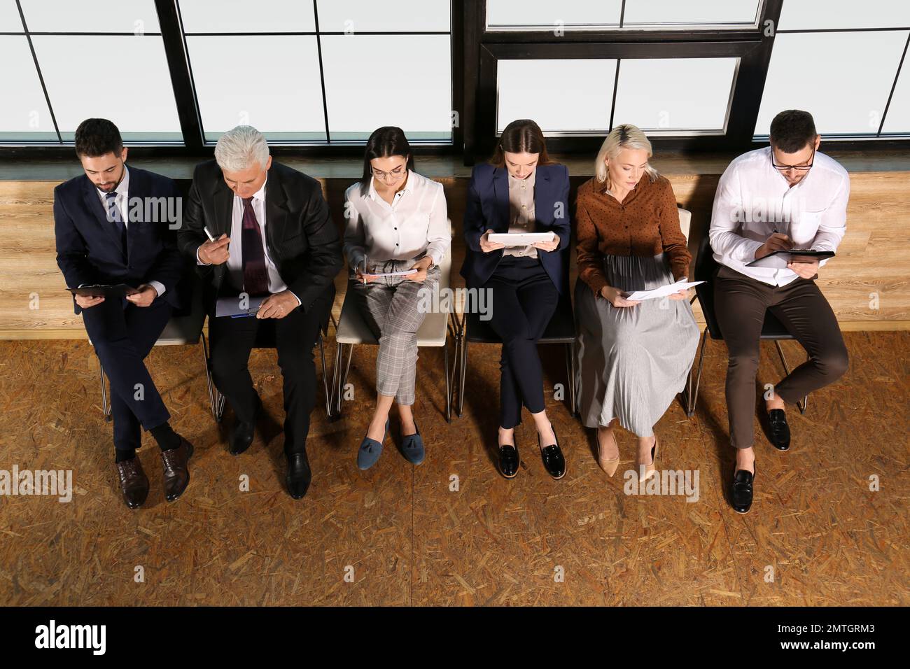 People waiting for job interview in office hall, above view Stock Photo ...