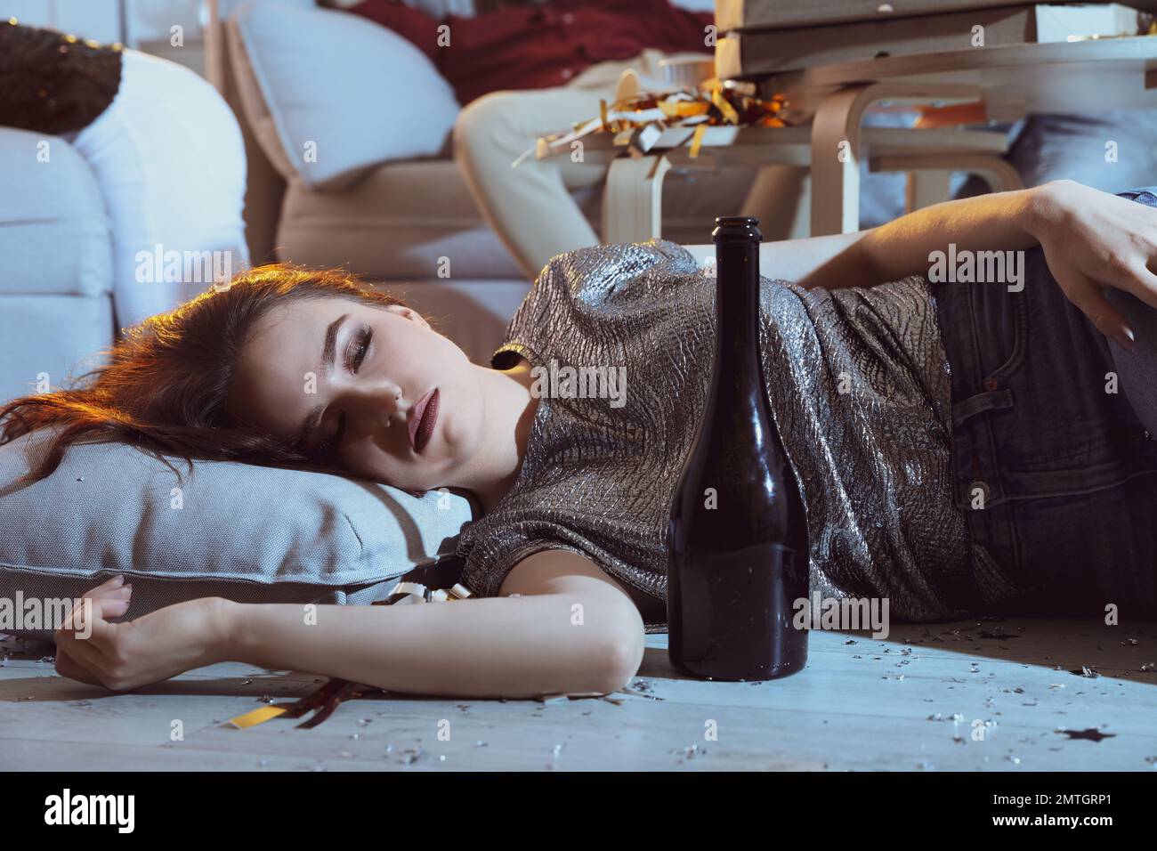 Young woman drunk on floor hi-res stock photography and images - Alamy