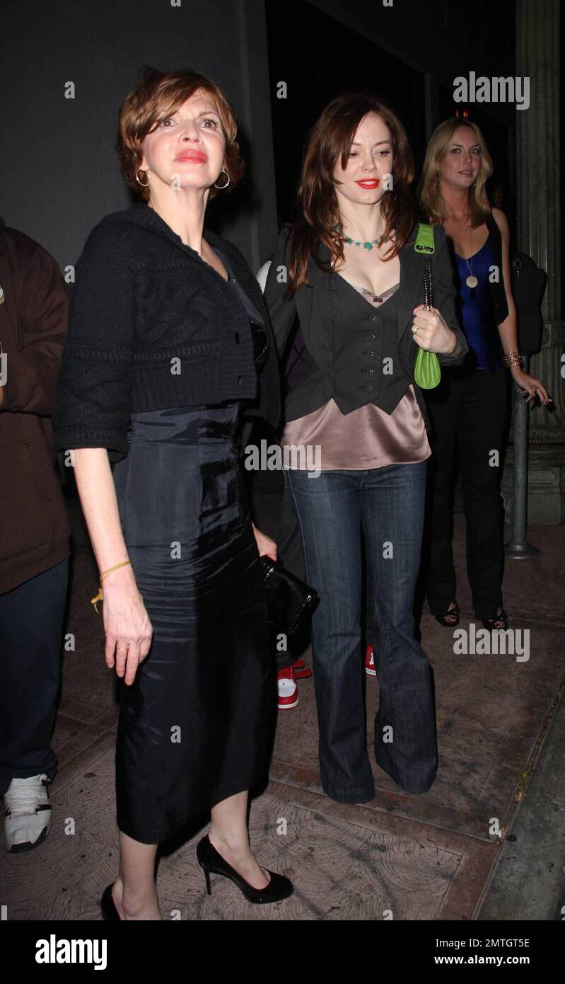 Actress Rose McGowan holds hands with her mother as they leave the restaurant Beso with Robert ...