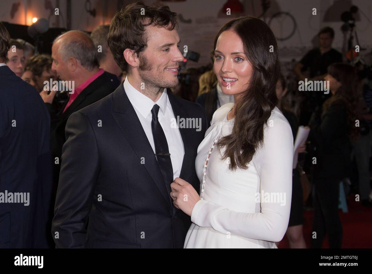 Actors Laura Haddock, right, and Sam Claflin pose for photographers ...