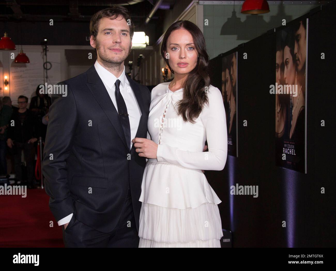 Actors Laura Haddock, right, and Sam Claflin pose for photographers ...