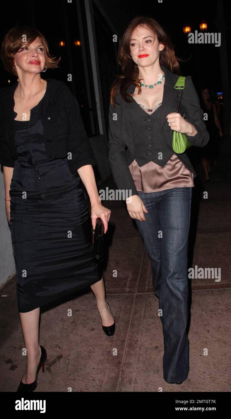 Actress Rose McGowan holds hands with her mother as they leave the restaurant Beso with Robert ...