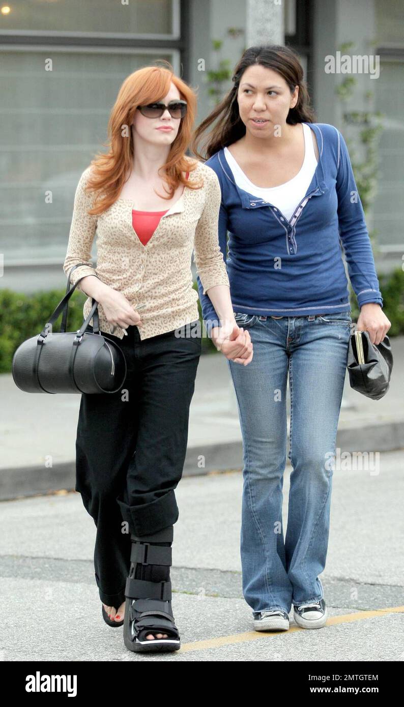 Rose McGowen hobbles out of the Neil George Salon with what appears to ...