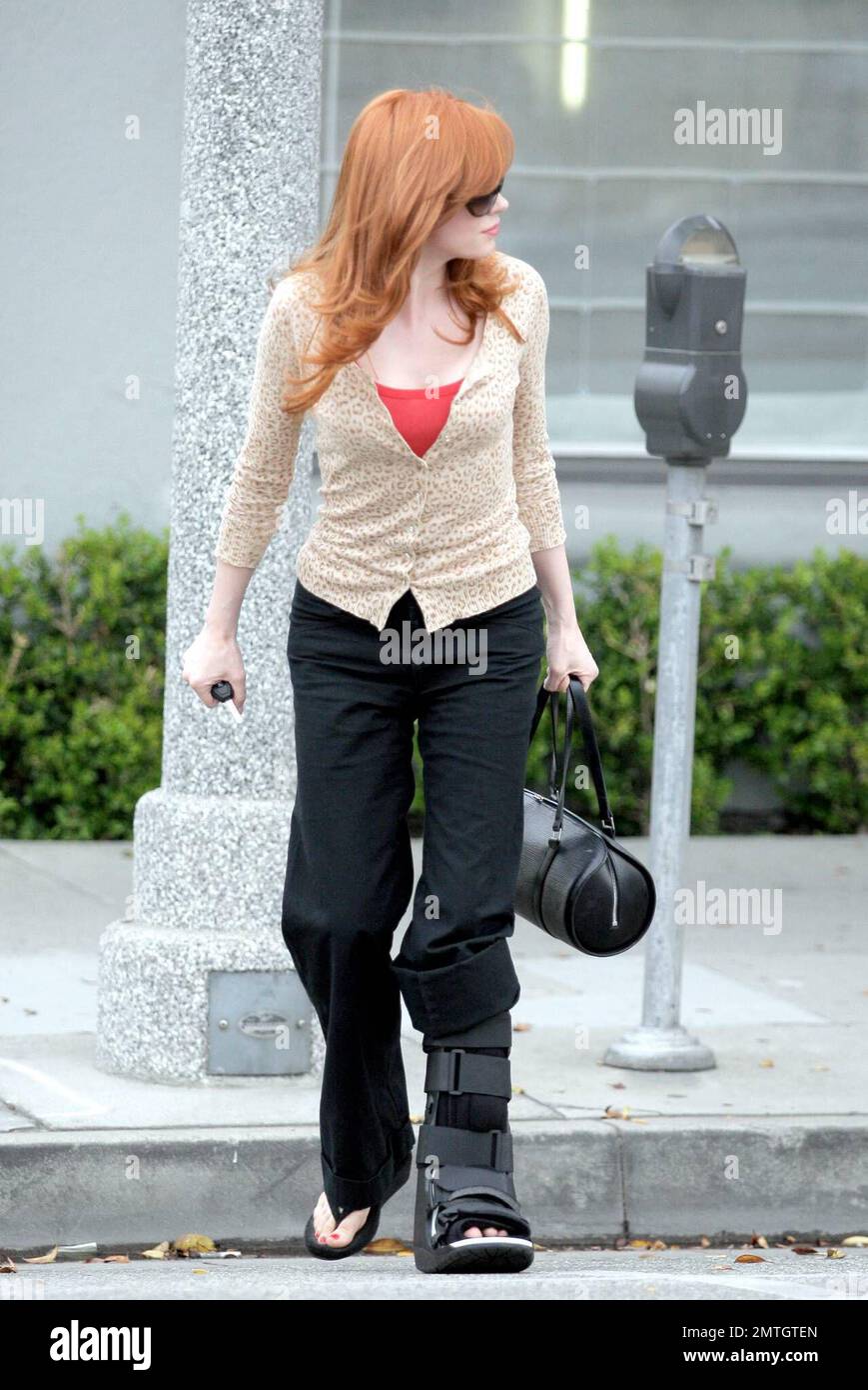 Rose McGowen hobbles out of the Neil George Salon with what appears to ...