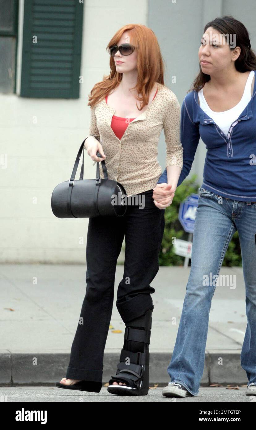 Rose McGowen hobbles out of the Neil George Salon with what appears to ...