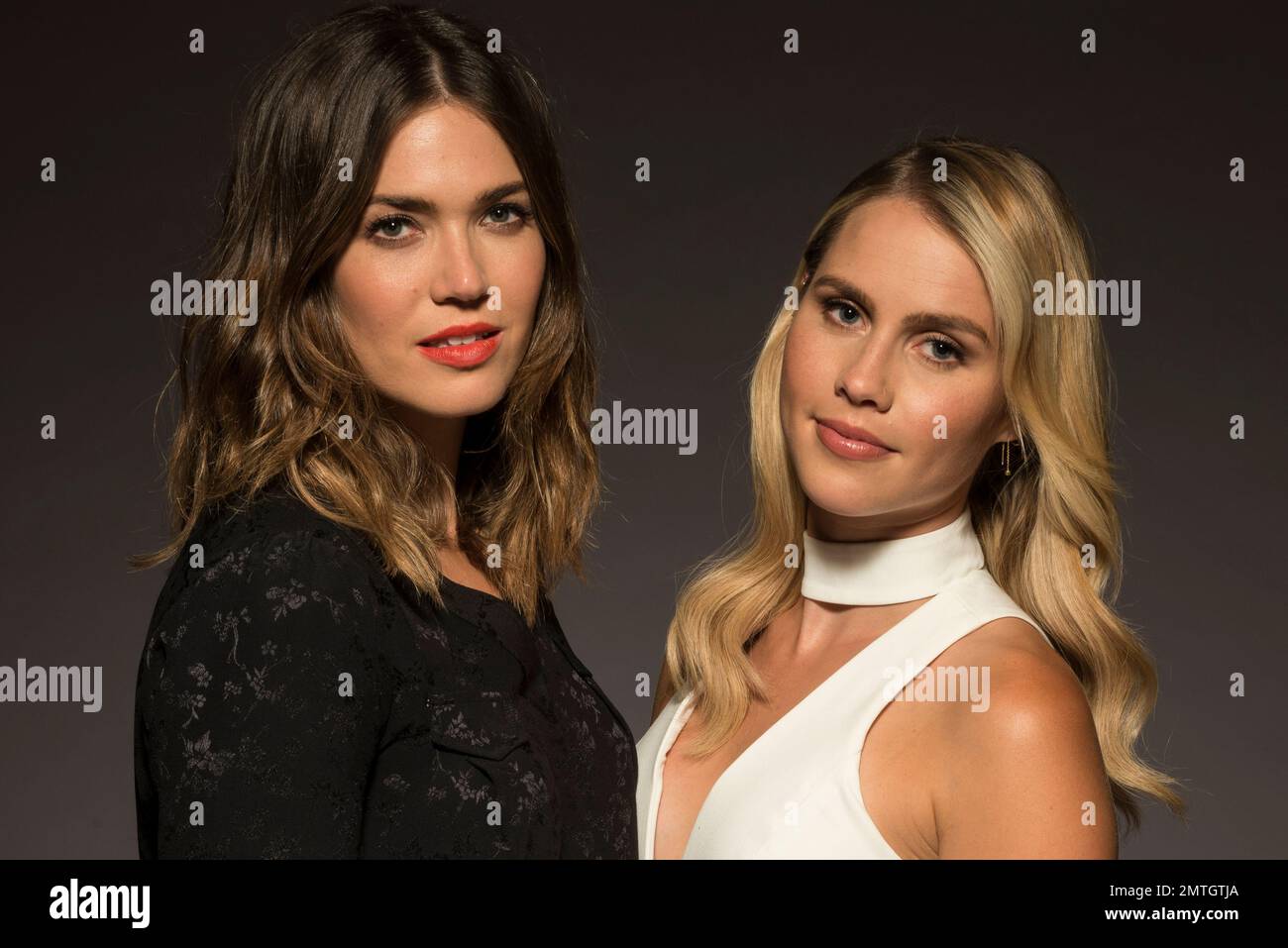 In this June 2, 2017 photo, Mandy Moore, left, and Claire Holt pose for ...