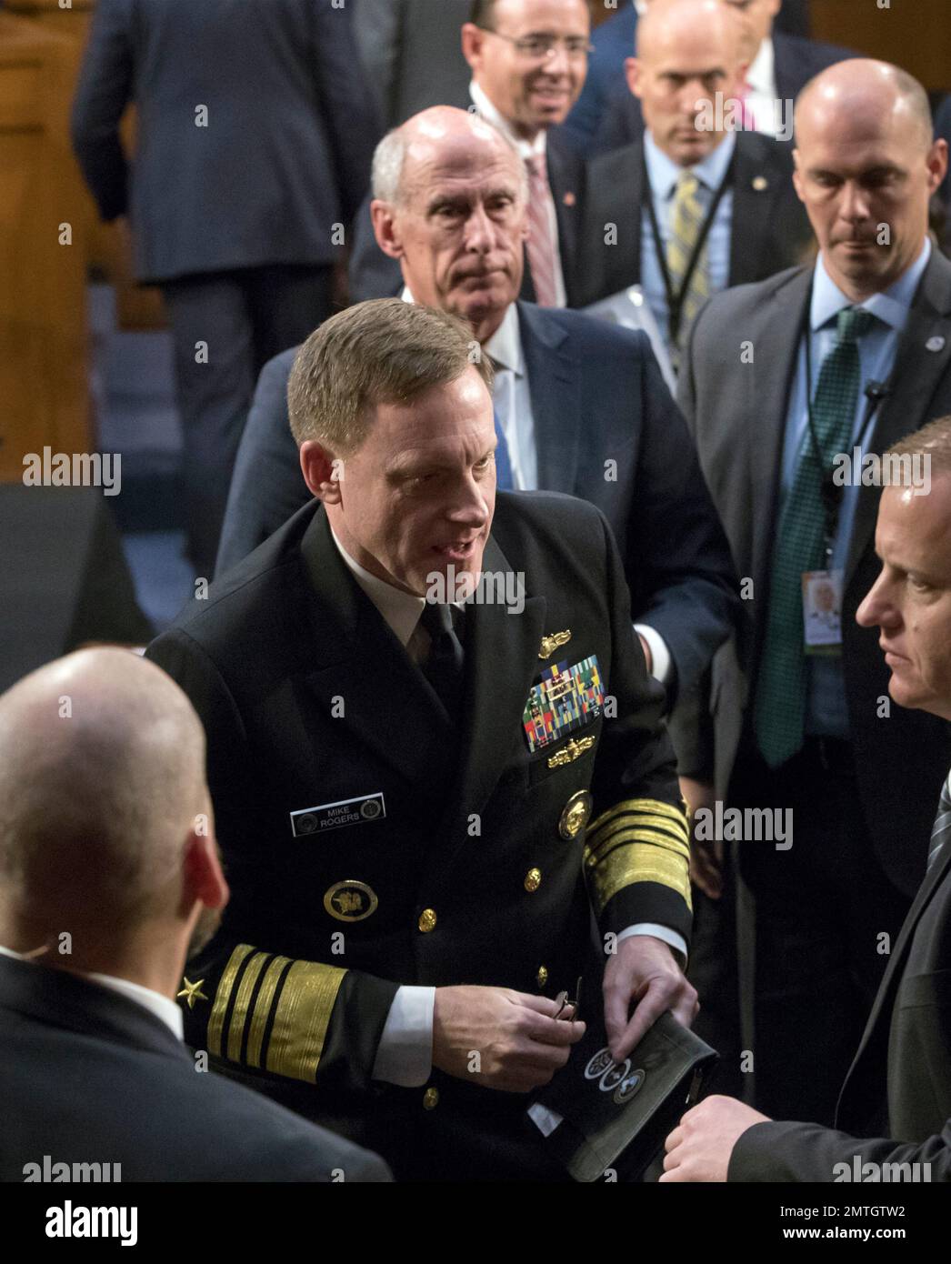 National Security Agency Director Adm. Mike Rogers, center followed by ...