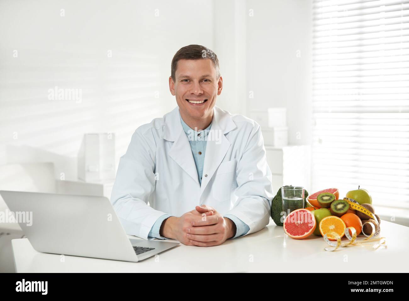 Male nutritionist in white hi-res stock photography and images - Alamy