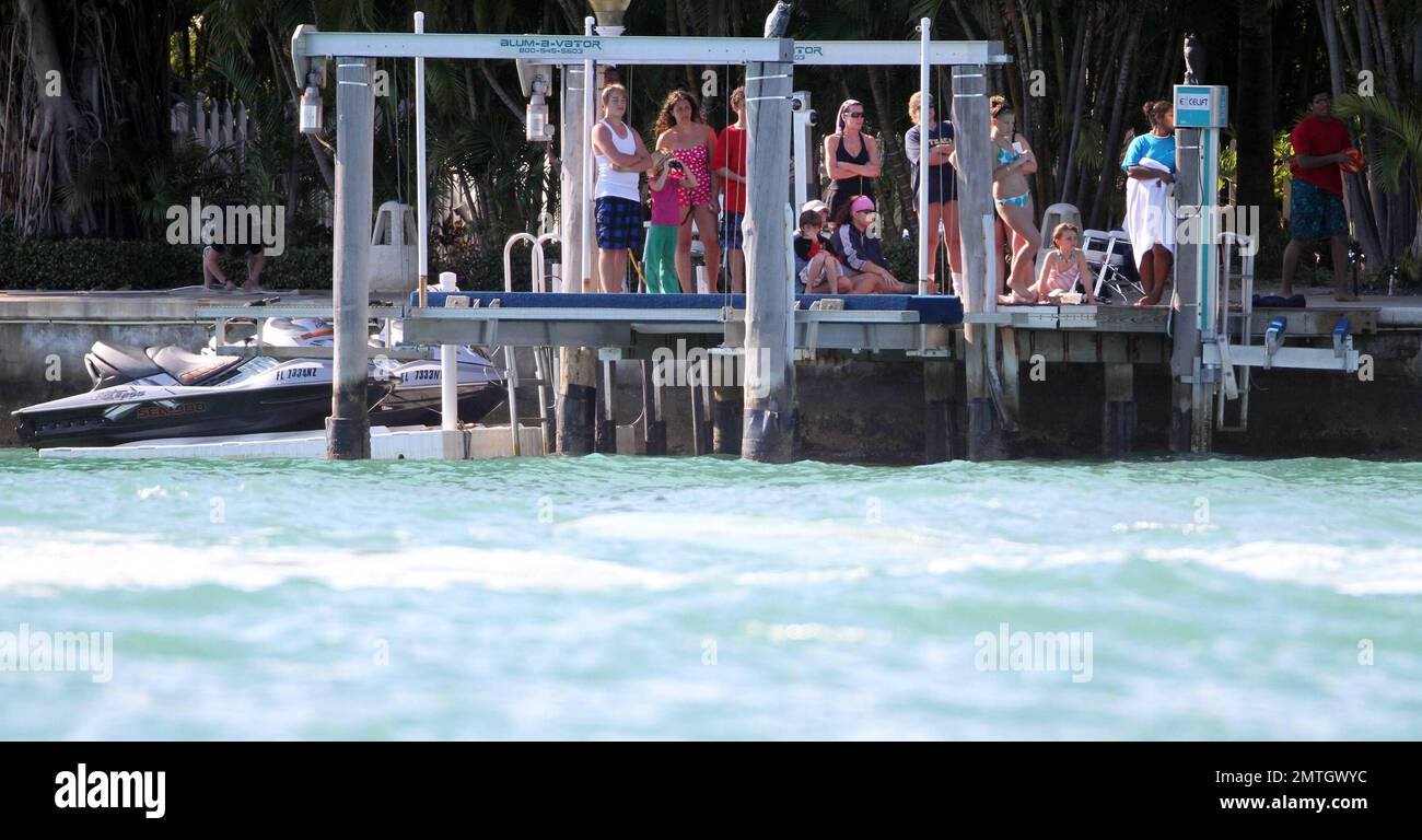 Rosie O'Donnell watches with a large crowd of people as Miami Dade Fire ...