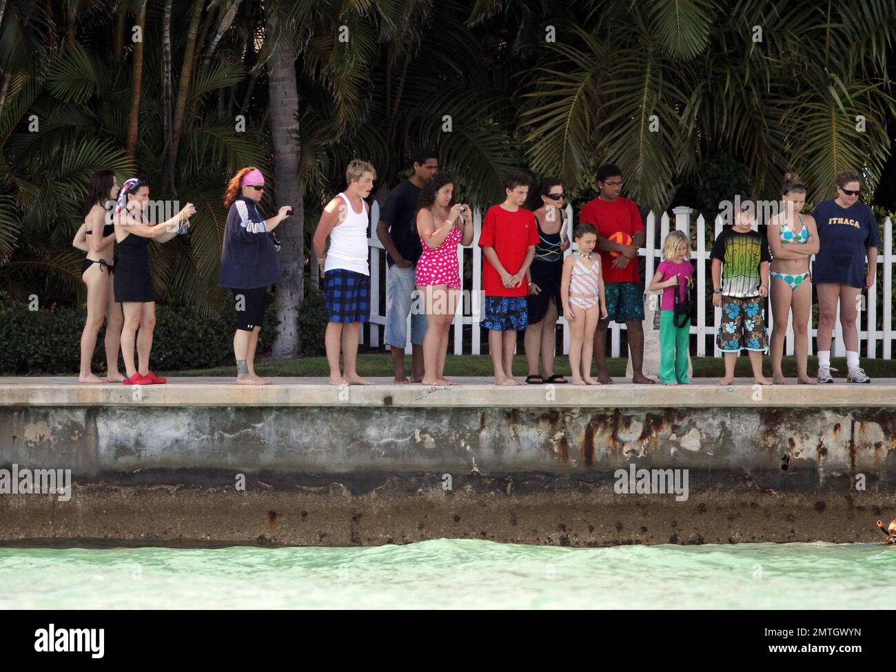 Rosie O'Donnell watches with a large crowd of people as Miami Dade Fire ...