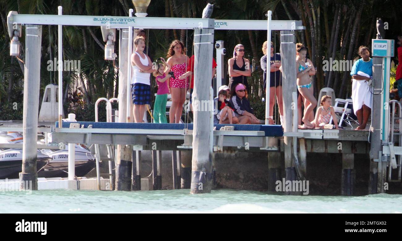 Rosie O'Donnell watches with a large crowd of people as Miami Dade Fire ...