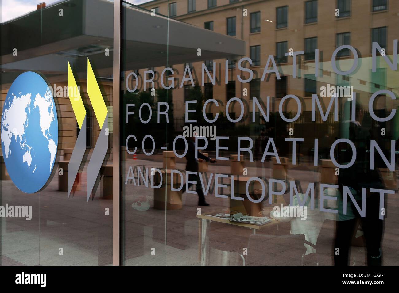 The logo at the entrance of the Organisation for Economic Co-operation ...
