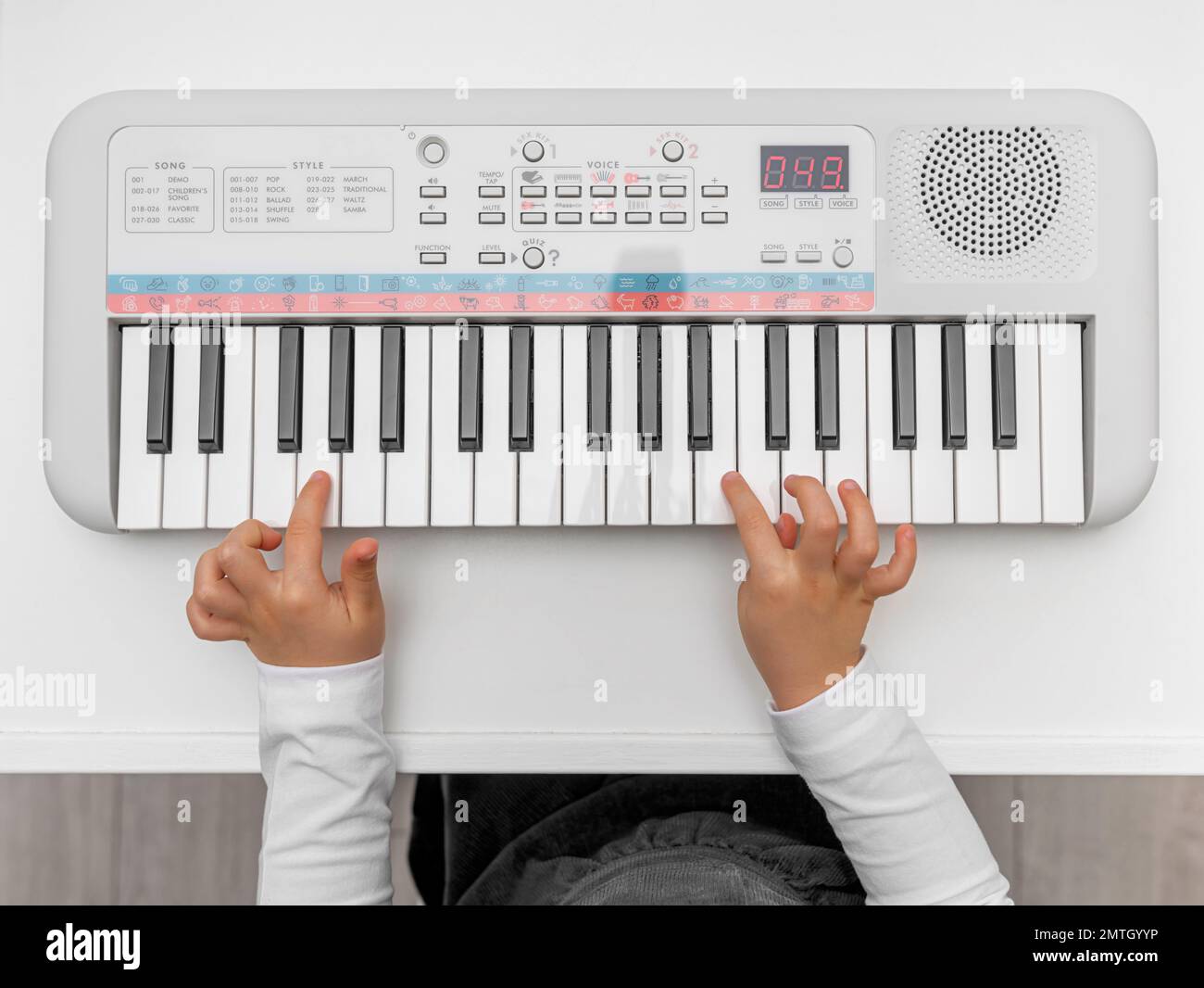 Children's hands on the keys of the synthesizer Stock Photo - Alamy
