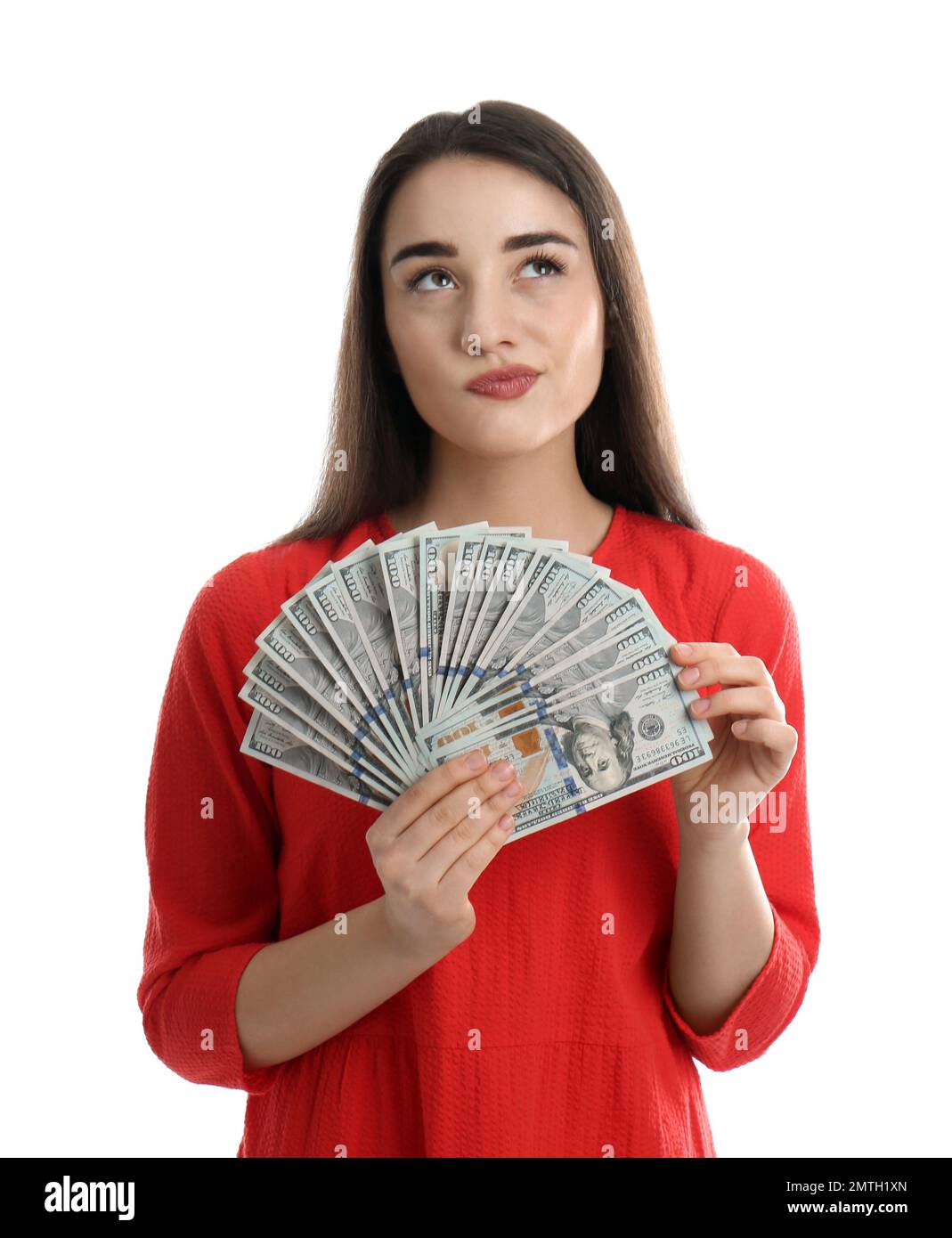 Emotional young woman with money on white background Stock Photo - Alamy