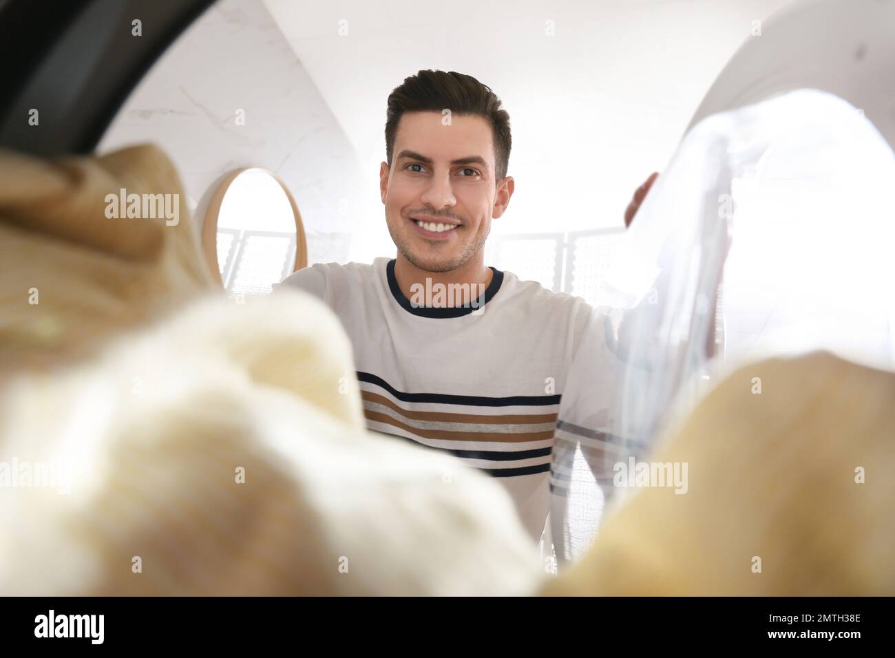 Wash washing machine clothes view from inside drum tumble person hi-res ...