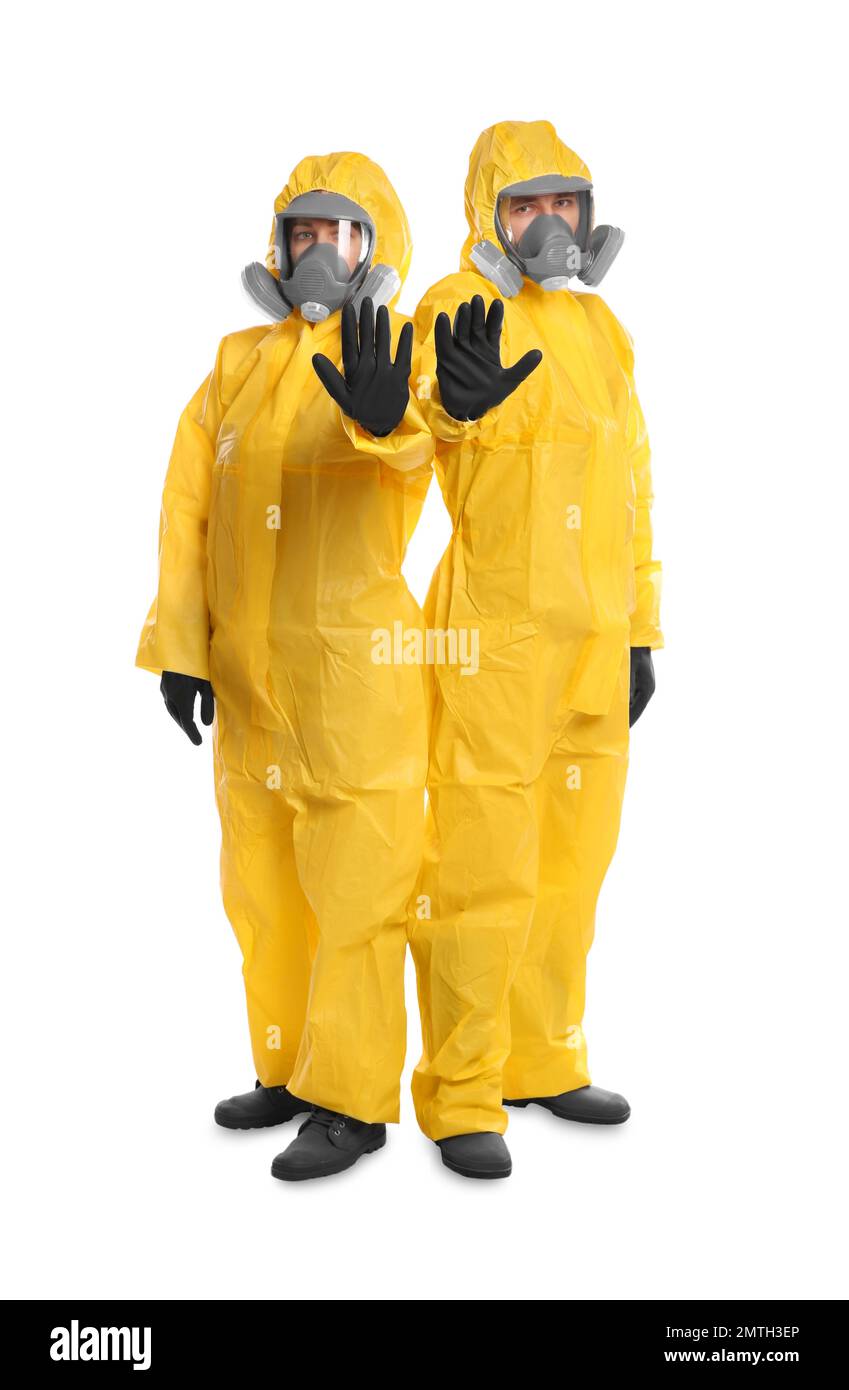 Man and woman in chemical protective suits making stop gesture on white ...